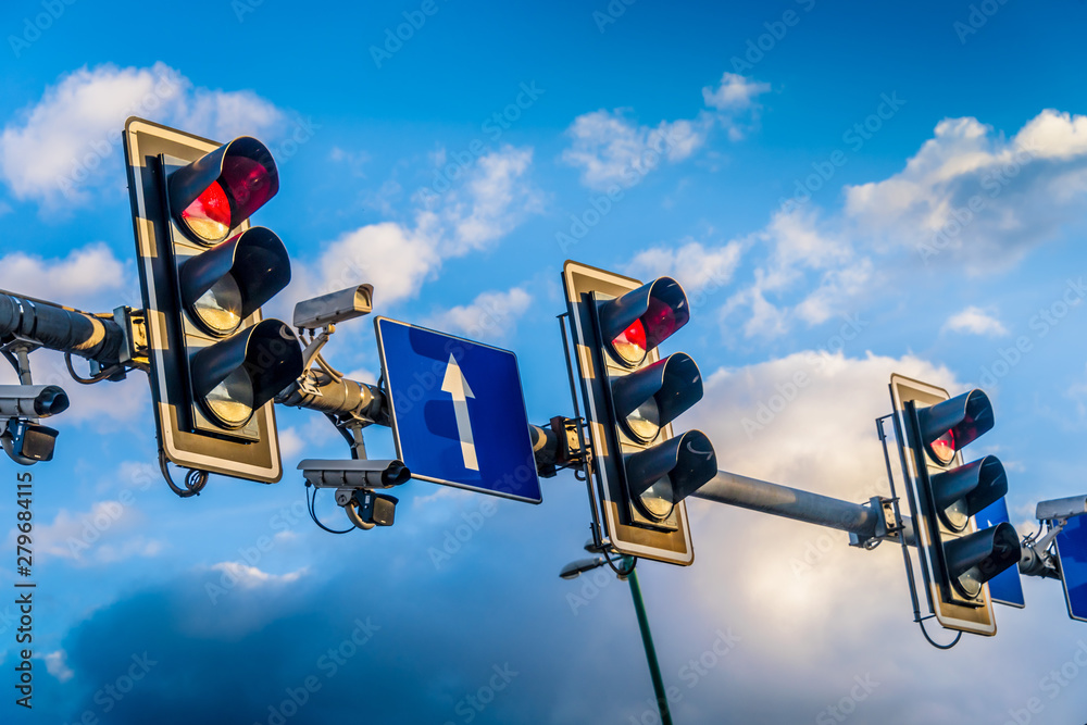 Traffic lights over urban intersection Stock Photo | Adobe Stock