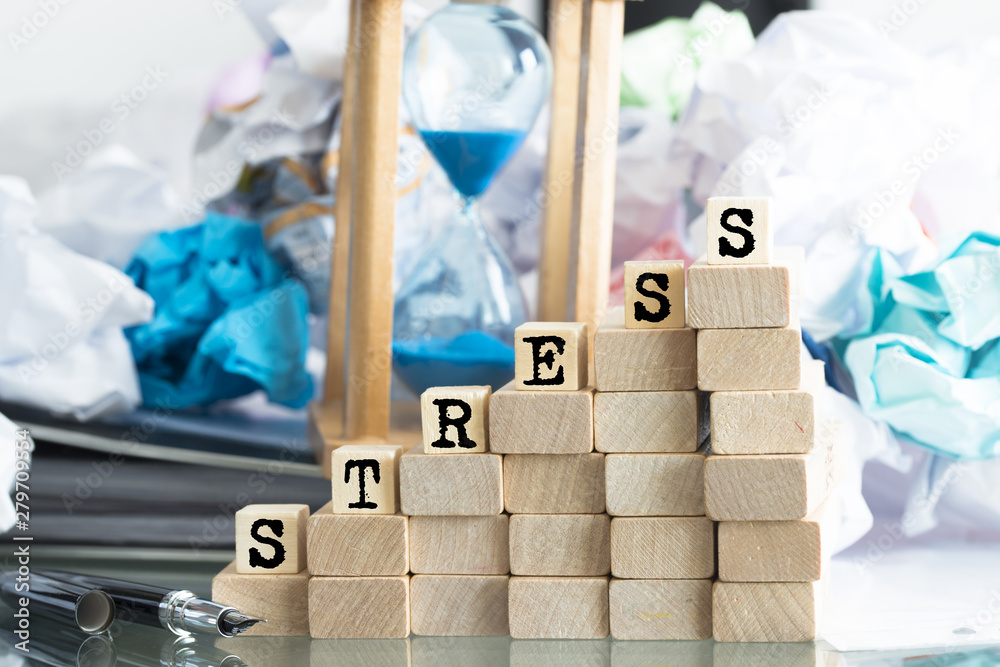 Stress level at work concept with wooden cubes ladder against crumpled ...