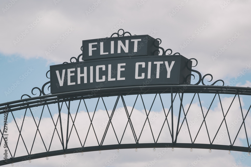 Flint, Michigan downtown gateway sign showing Vehicle City. Known ...