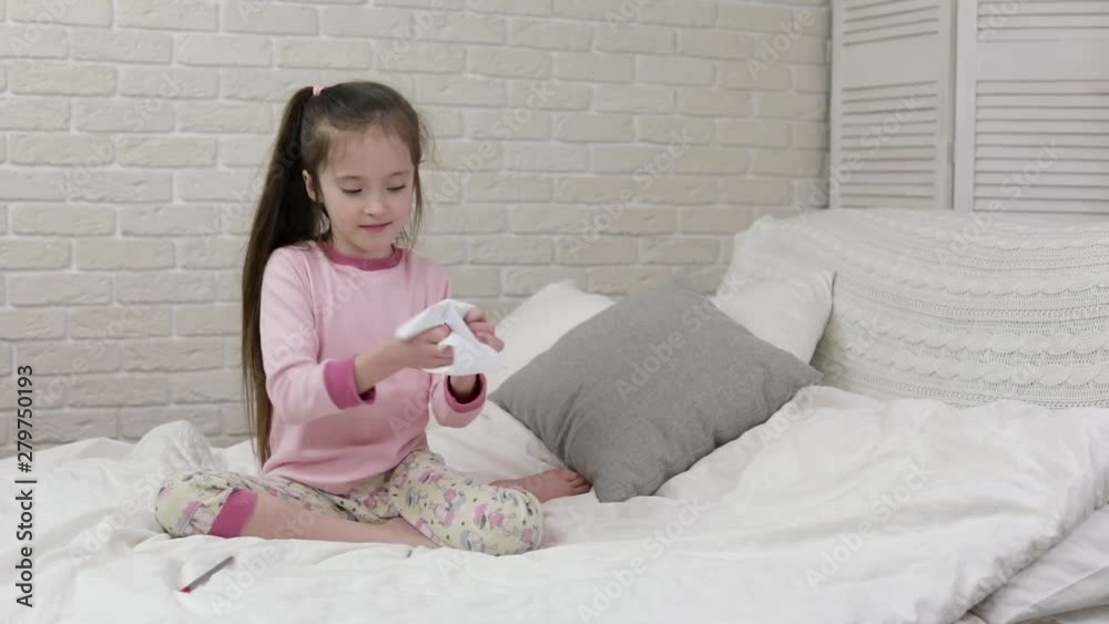 little girl drawing pictures while lying on bed.drawing fails. upset ... little girl drawing pictures while lying on bed.drawing fails. upset ...