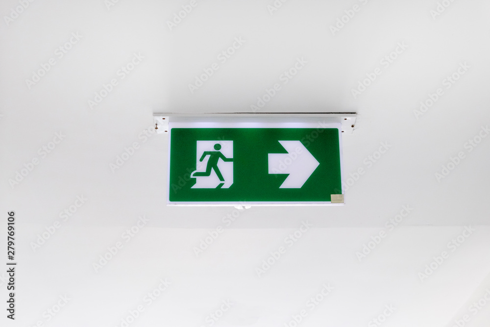 Fire exit sign. Emergency fire exit door exit door on ceiling. Stock ...