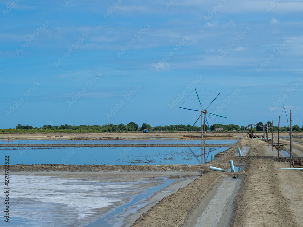 Sea salt fields local farm industry on a beautiful blue sky in Thailand ...