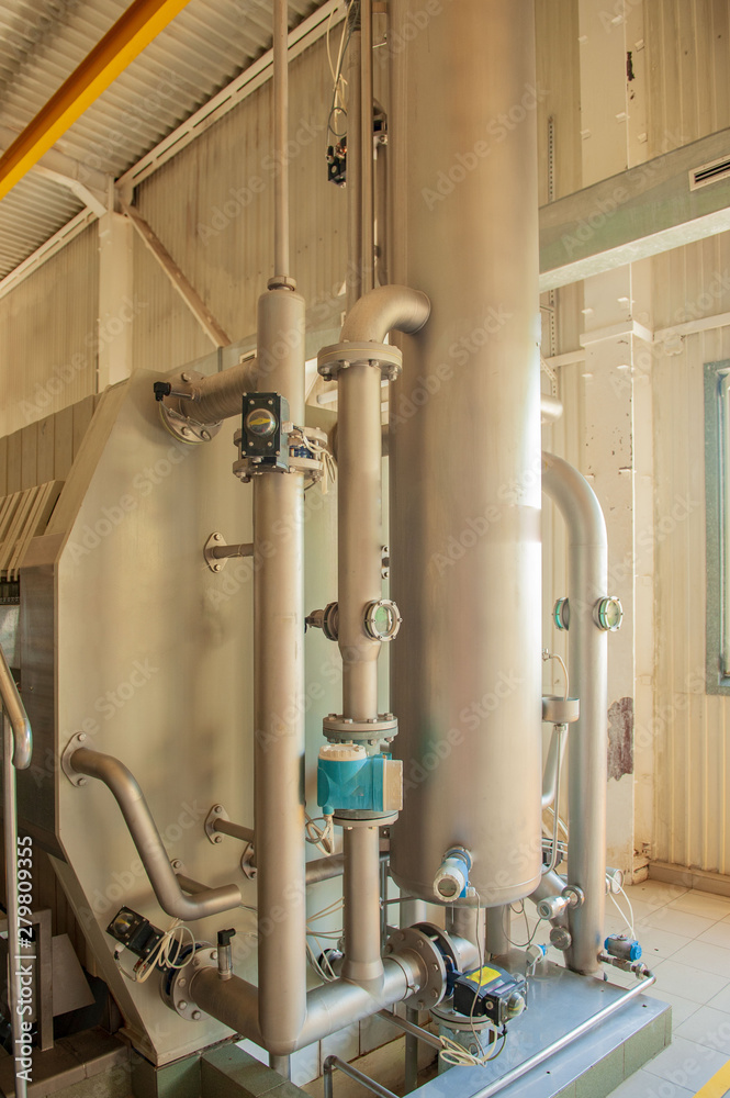 Equipment for preparation of beeer..Lines of metal tanks in modern ...