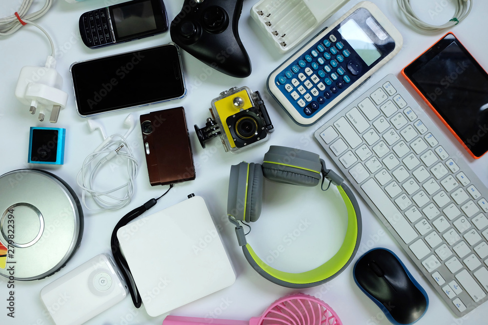 Many used modern Electronic gadgets for daily use on White floor, Reuse ...