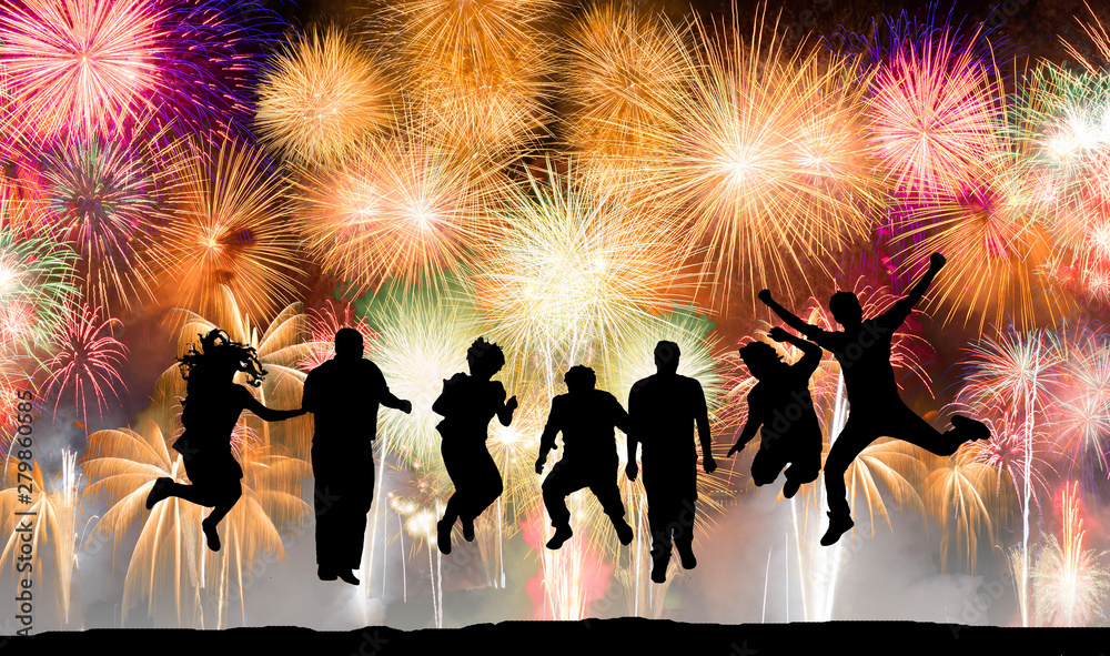 Silhouette of happy people jumping over firework, concept about having ...