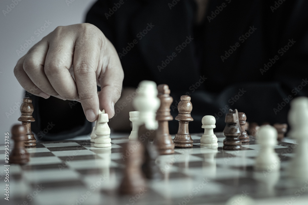 Close up shot hand of business woman playing the chess board to win by ...
