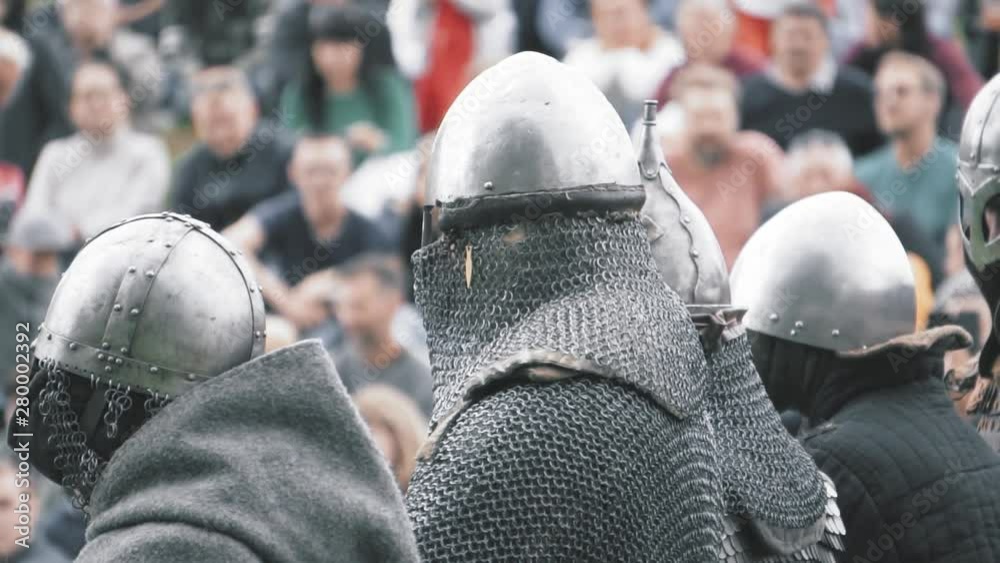 Vidéo Stock Knight warriors in front of crowd. Medieval soldiers in ...