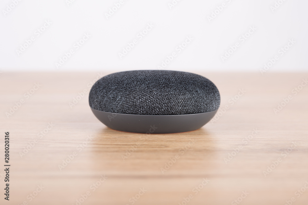 digital voice assistant with wood background Stock Photo | Adobe Stock