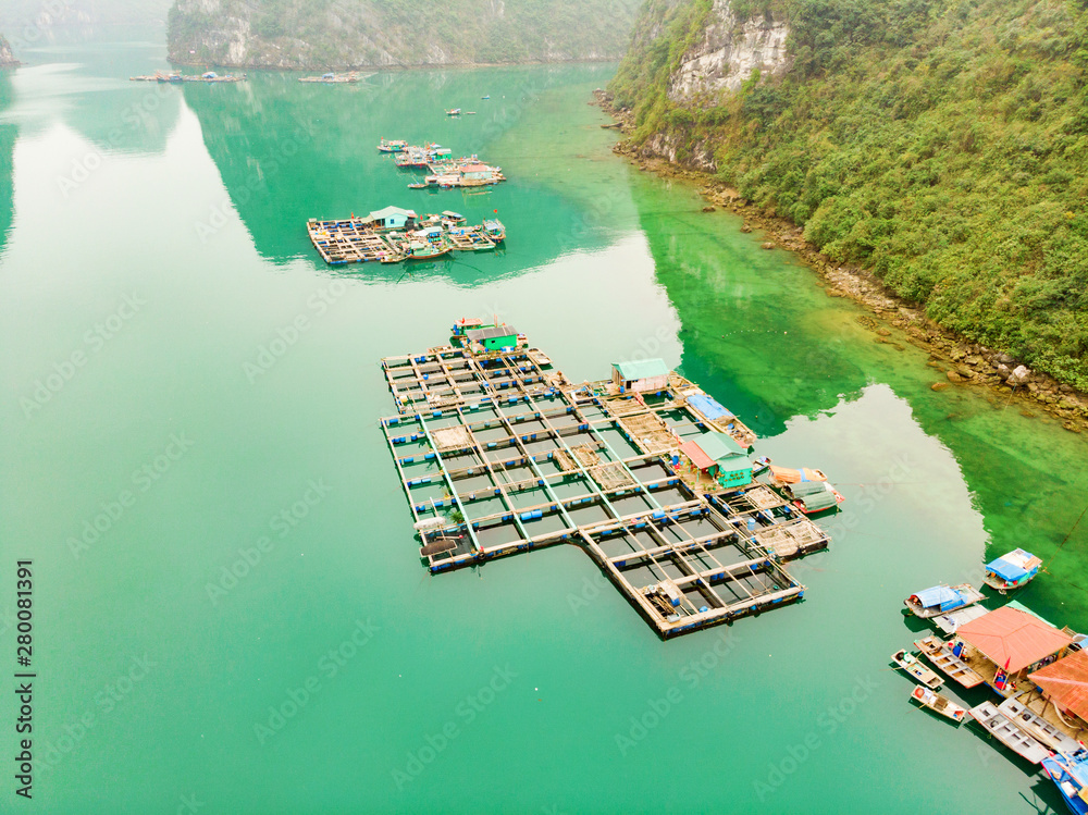 The traditional Cua Van Floating Village in Halong Bay Stock Photo ...