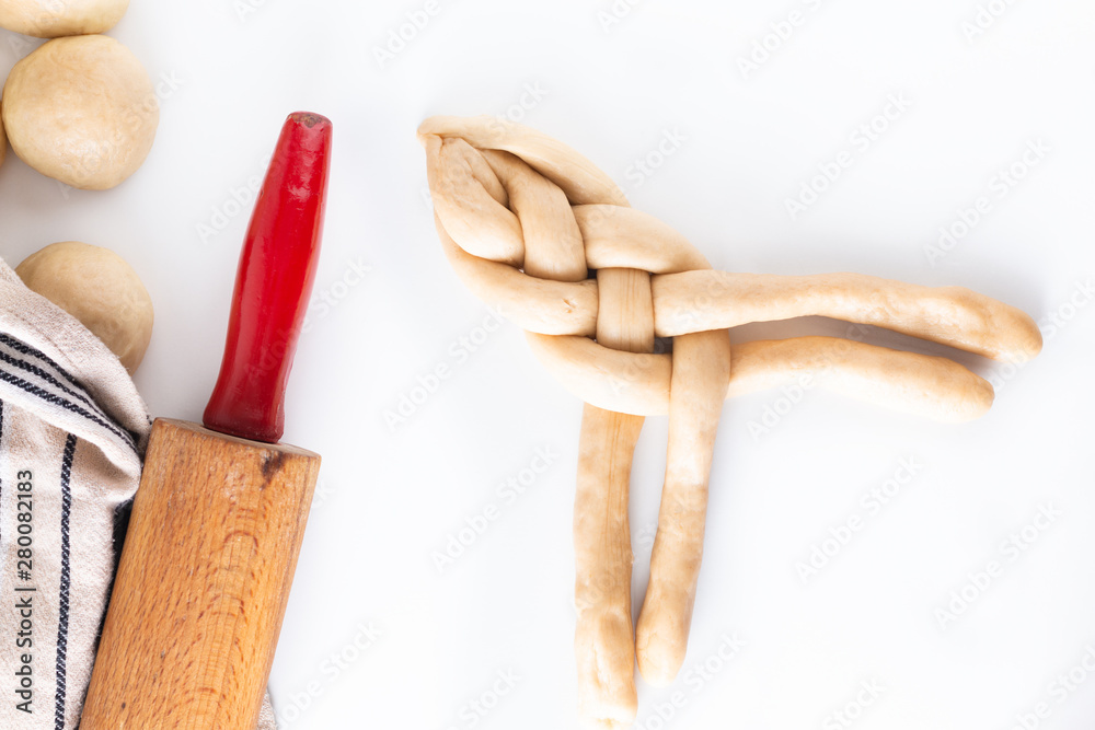 Homemade food concept process braiding bread braid challah dough on ...