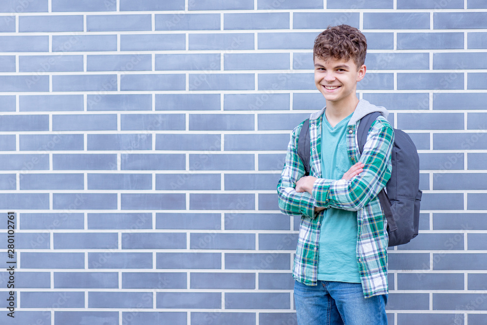 Schoolchild go to school with backpack. Smiling cute child - teen boy ...