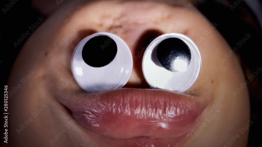 A funny ugly duck face, made by putting googly eyes on the chin of a ...