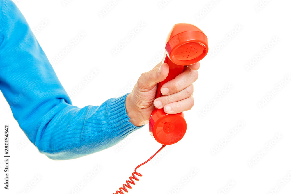 Hand hält ein rotes Telefon als Notruf Konzept Stock Photo | Adobe Stock