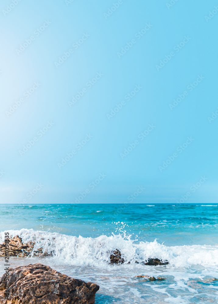 Soft wave crashing stone at bay. Stones by the sea. Sea wave breaks on ...