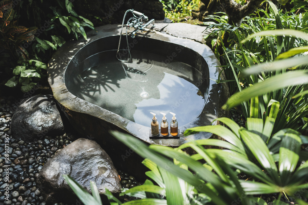 Luxury stone outdoor bath in tropical green jungle. Bali, Ubud. Concept ...