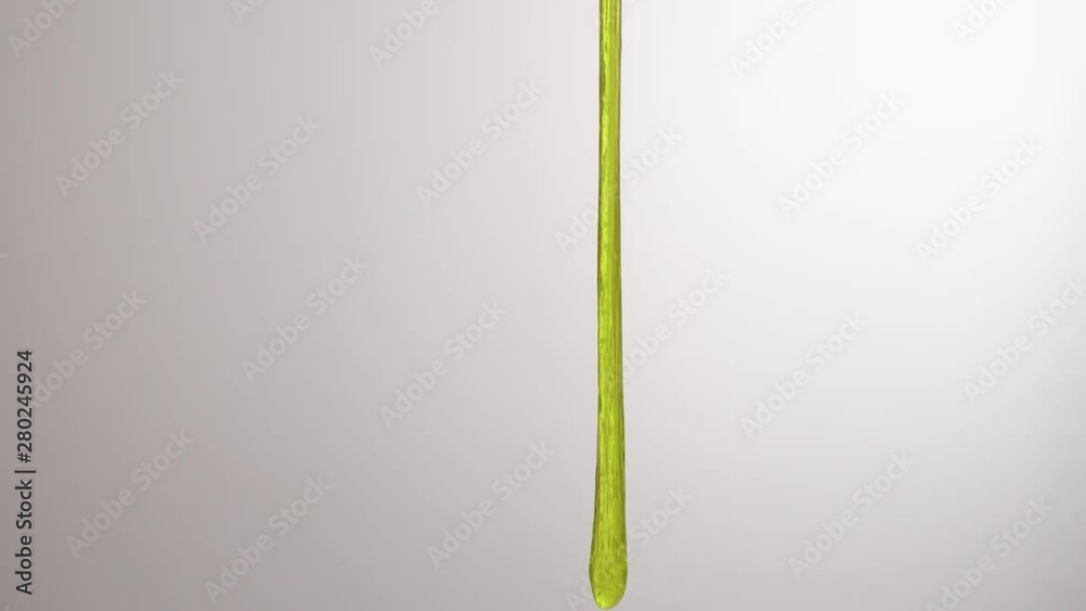 A close-up of green slime stretching and falling down. Cool mucus and ...