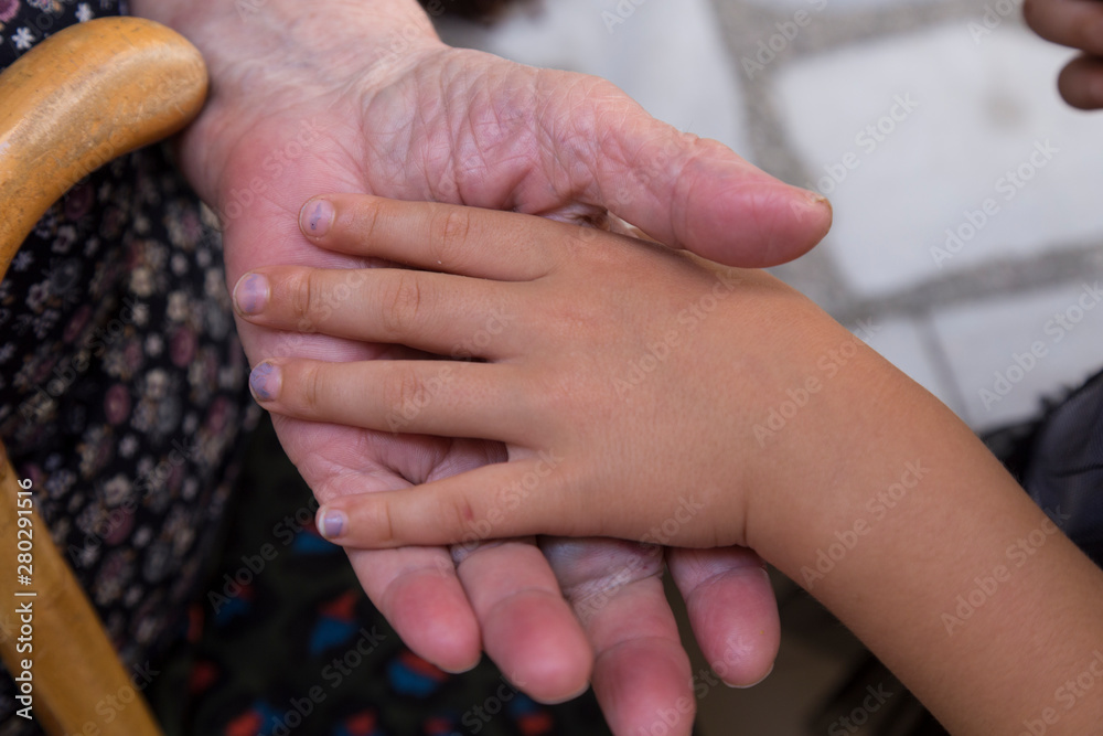 child hands on the old woman wrinkled ,celebrate the victim feast of ...
