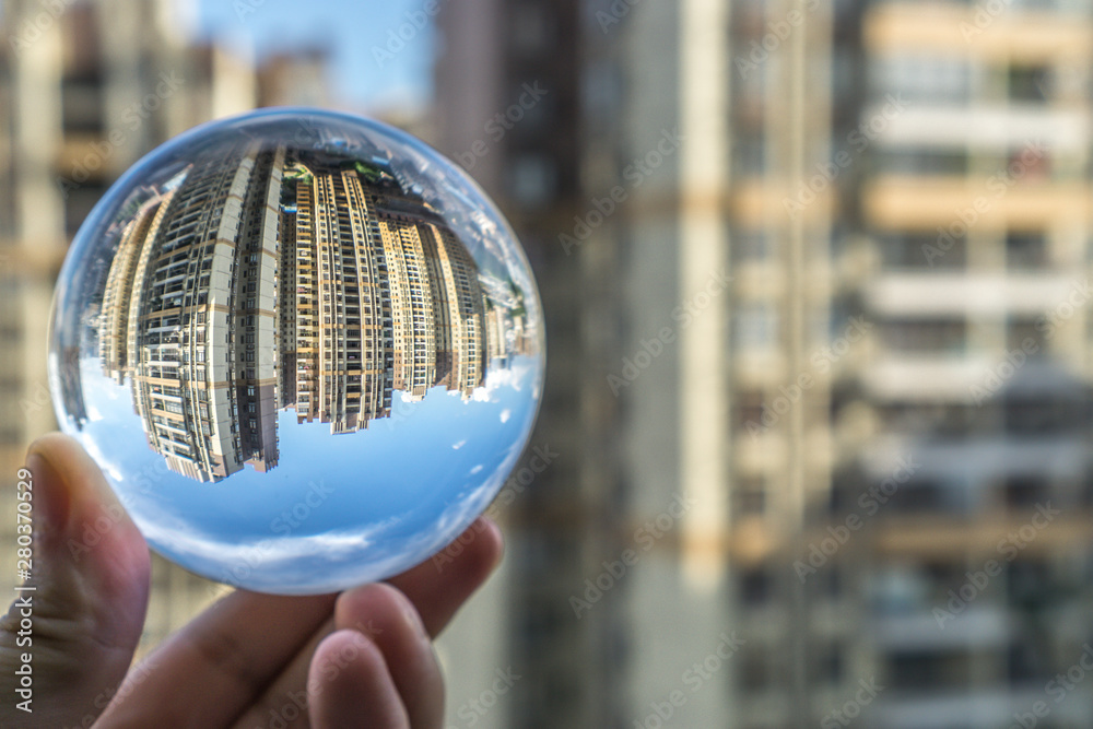 round Glass ball with big city buildings background Stock Photo | Adobe ...