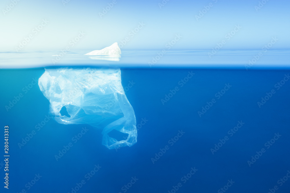 plastic bag floating at water, iceberg metaphor Stock Photo | Adobe Stock