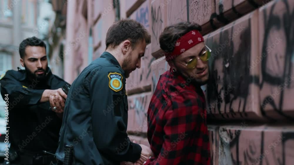 Vídeo do Stock: Portrait policeman with pistol arrest robber in ...