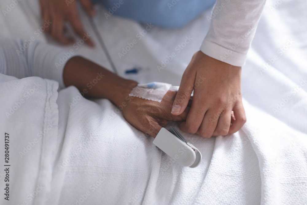 Female doctor consoling female patient in the ward at hospital Stock ...