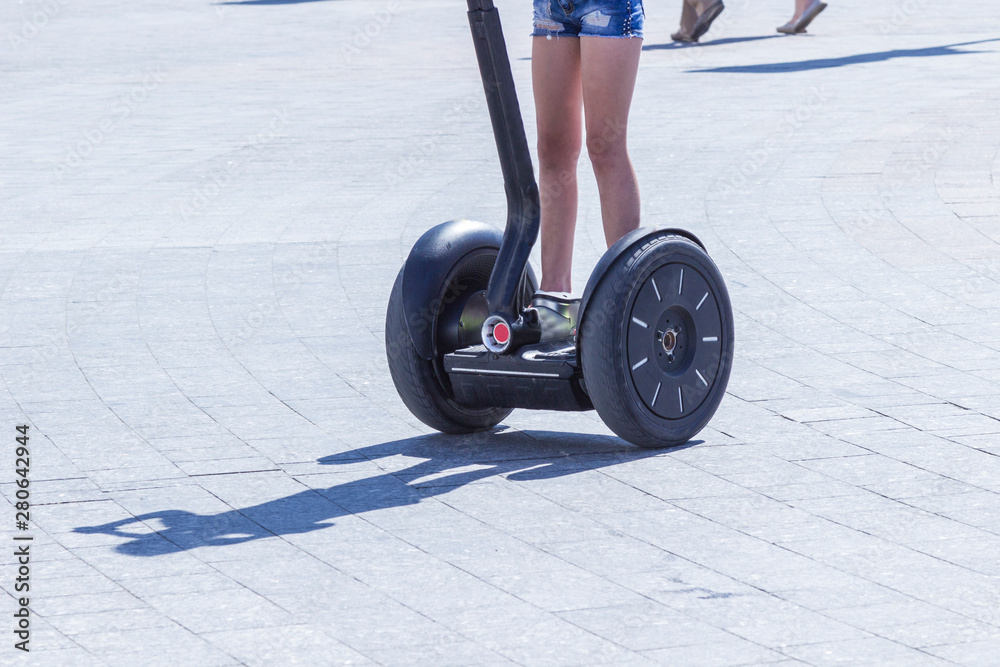 Children's feet with scratched knees on an electric scooter Stock Photo ...