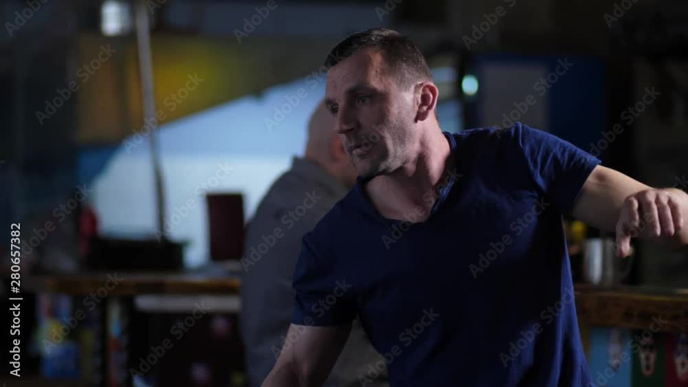 Close-up of drunk man pestering attractive female coming to bar ...