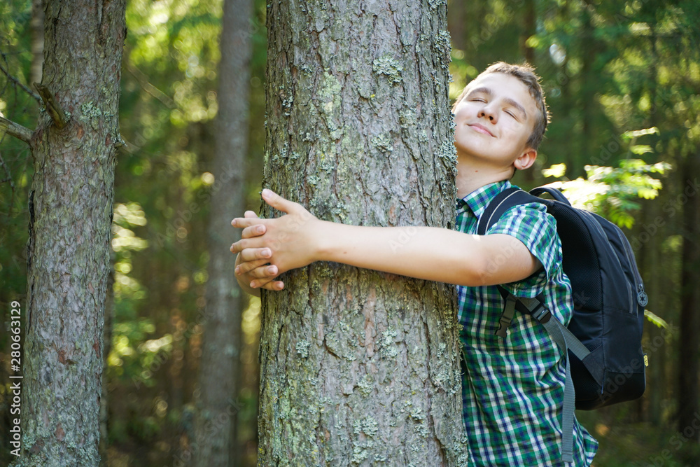 Young Boy Hugging A Tree
