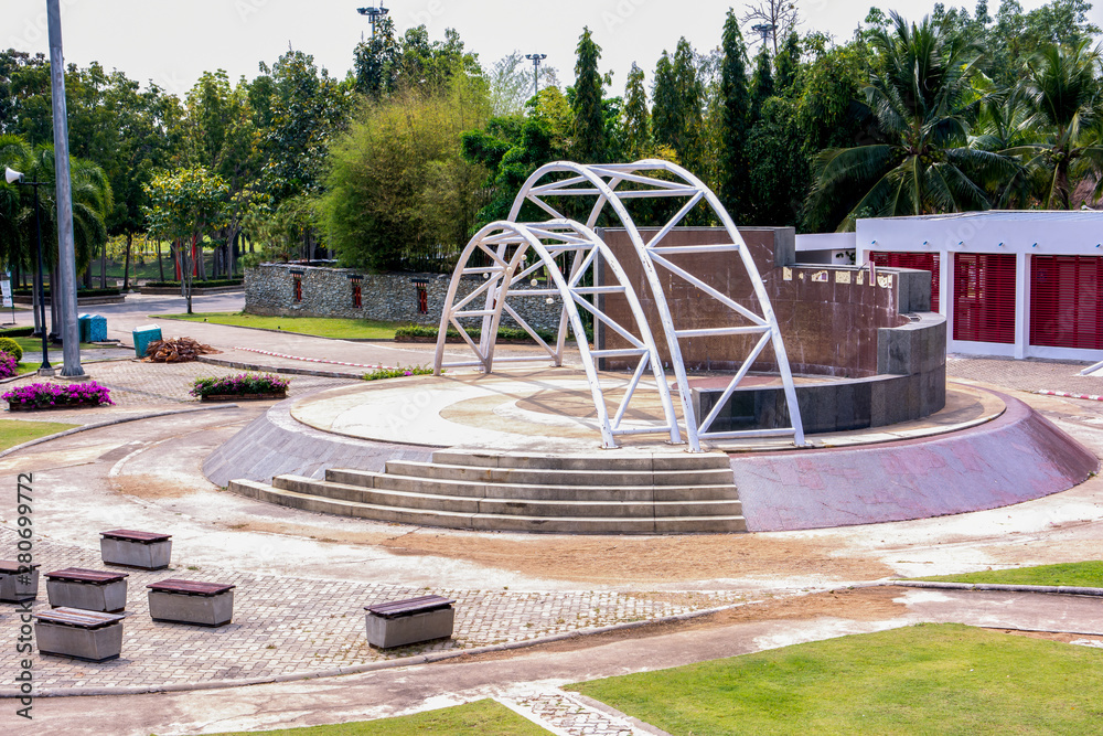 Public outdoor performance stage with arch metal roof background ...