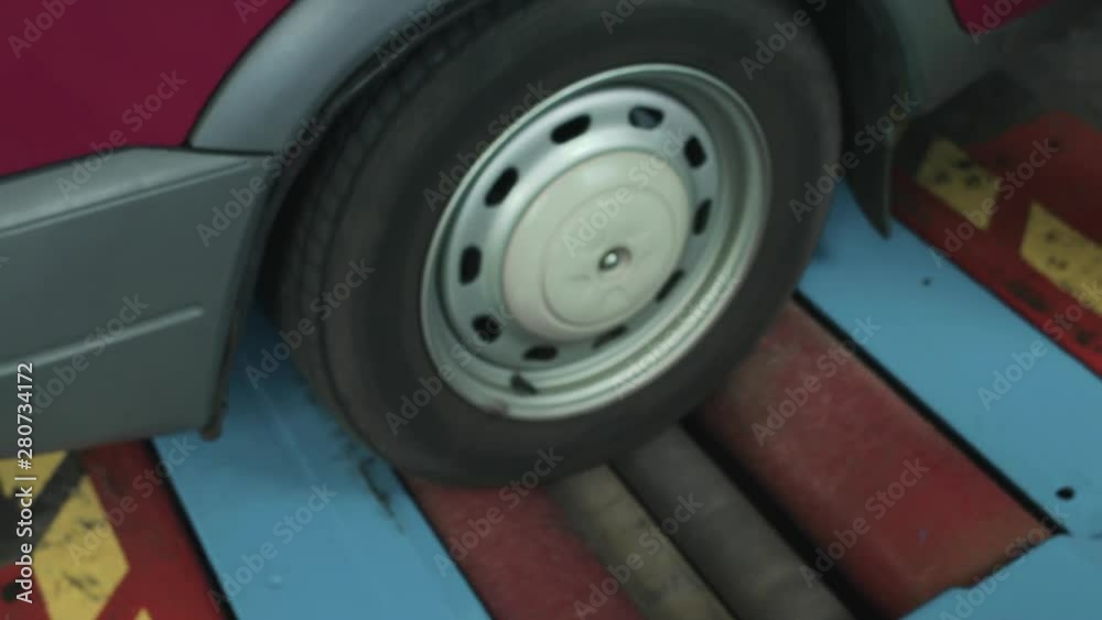 Checking the brake system of the car using the rollers at the service ...
