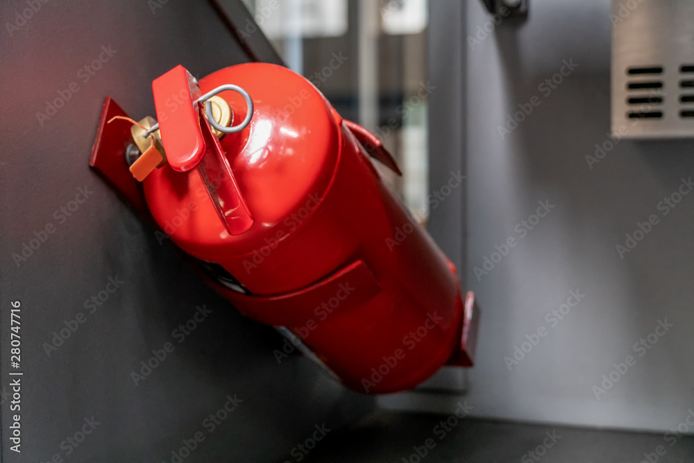 Red fire extinguisher closeup in the funicular cabin. The concept of ...