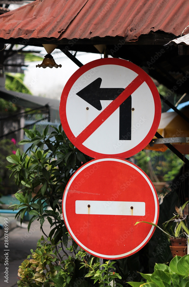 No left turn and no entry warning road signs in a rural village Stock ...