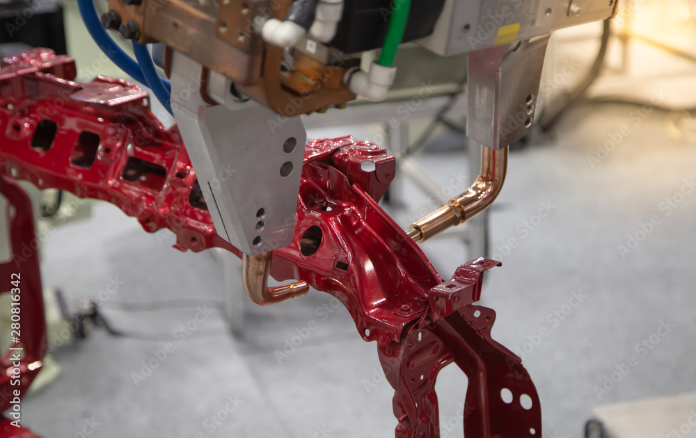 Robot spot welding motorcycle frame in automotive industry Stock Photo ...
