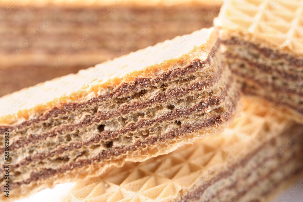 Delicious crispy wafers with chocolate filling as background, closeup ...