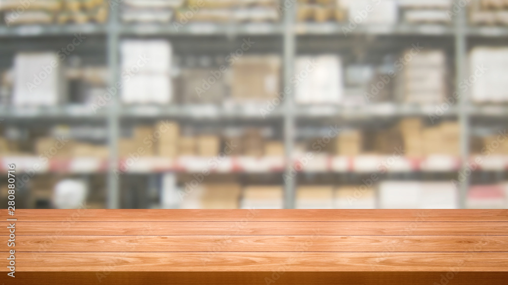 Wood table in warehouse storage blur background with empty copy space ...