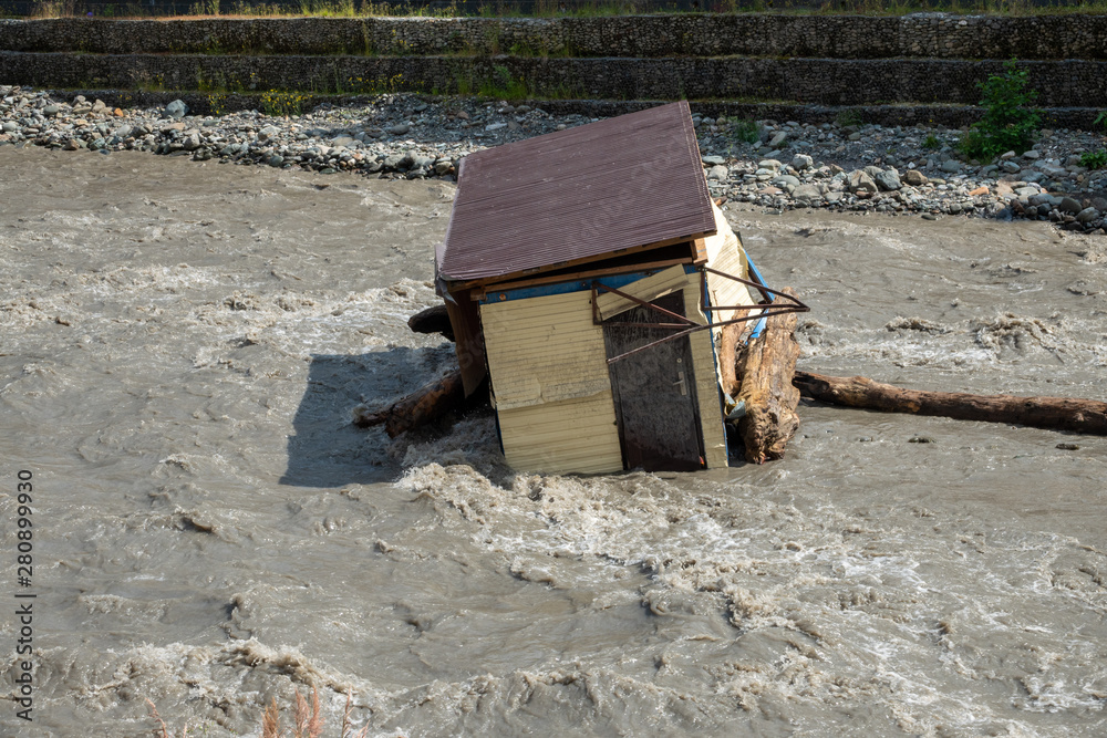 A small house destroyed the mudflow in the mountains. A small house was ...