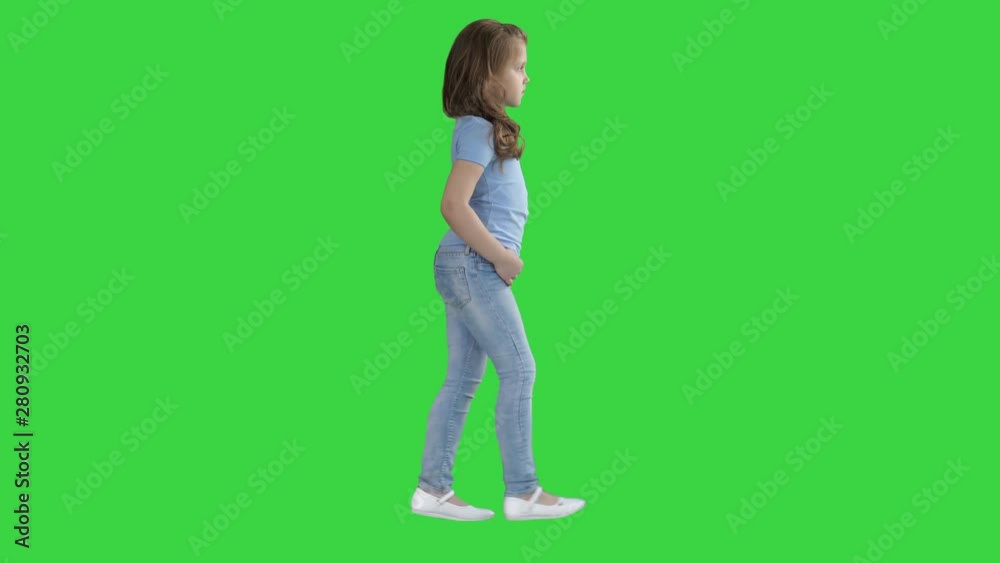 Little cute child smiling in casual and walking on a Green Screen ...