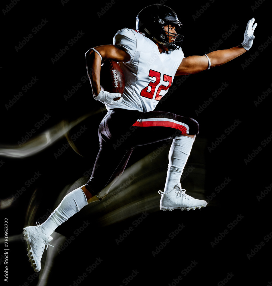one african american football player man studio shot isolated on black ...
