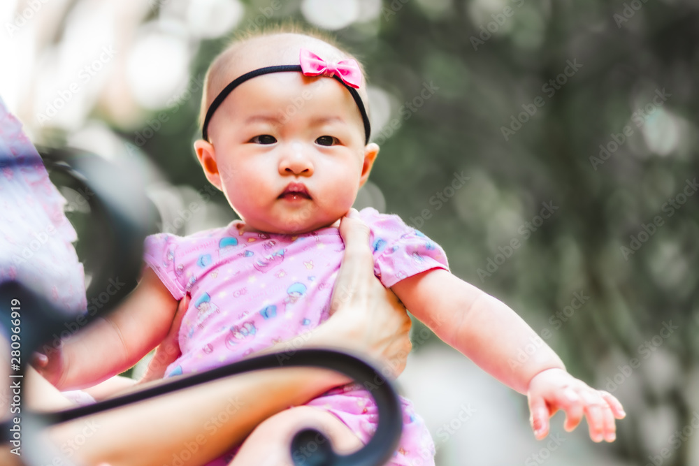 Asian baby happy in the graden.Asian baby girl happy family time. Stock ...