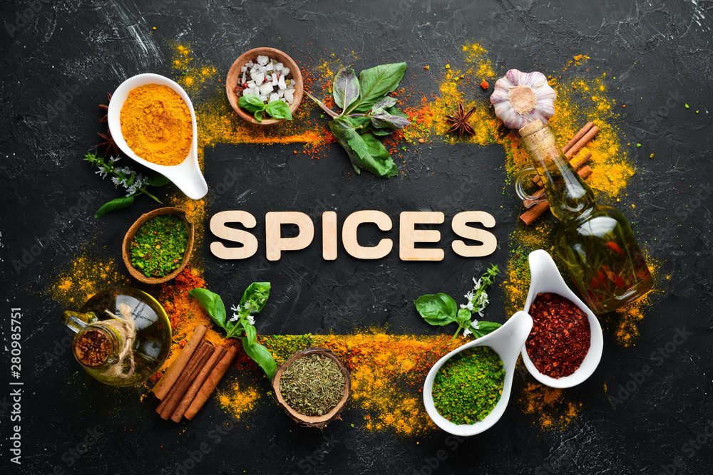 Indian spices on a black stone background. The word "spice" Indian ...