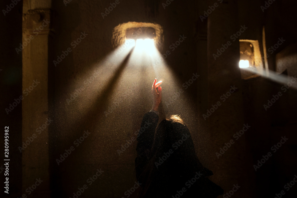 Hand reaching to light, Surreal - Ancient Stock Photo | Adobe Stock