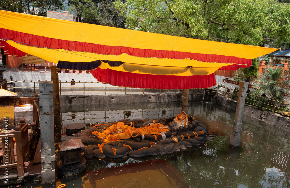 Budhanilkantha statue of the Hindu god Vishnu which lies in a reclining ...