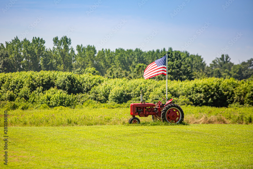 Symbols of American farming: tractor and flag Stock Photo | Adobe Stock