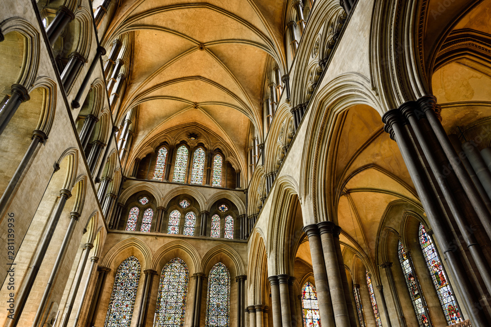 North Transept vaulted ceiling with pillars and arches and stained ...