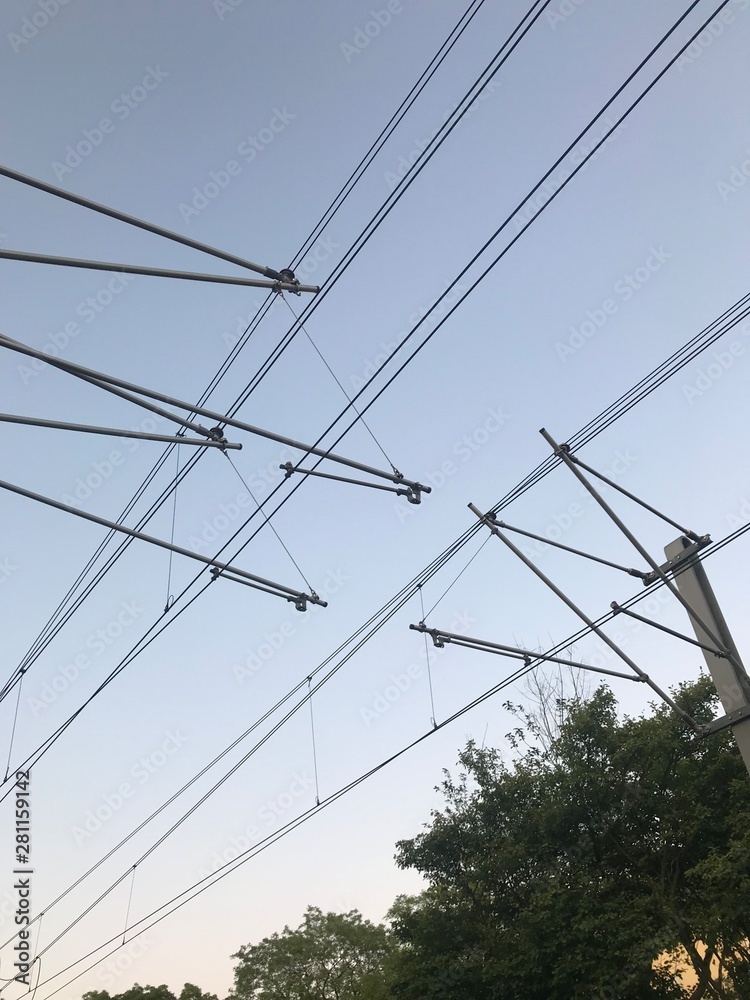 Catenary of a street car line in the late afternoon - overhead line for ...
