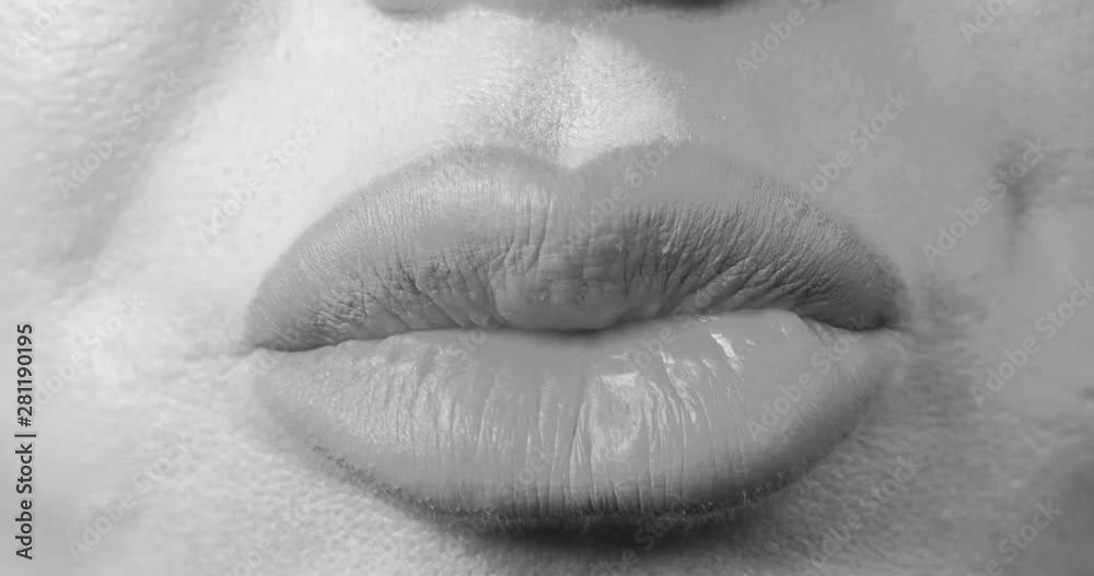 Crop of lightly opened female full lips with lipstick on them in ...