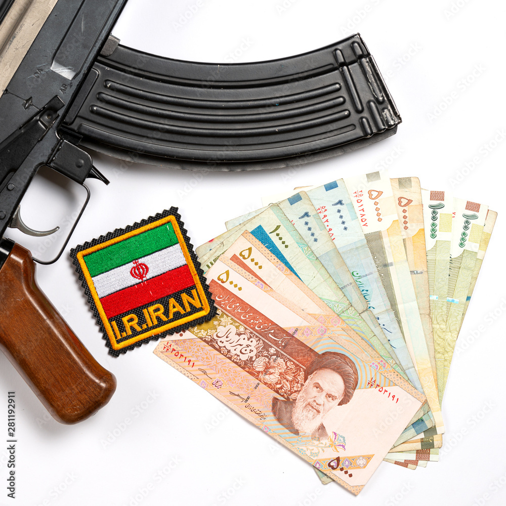 Foto de Soviet automaton AK 47 against the backdrop of Iranian money ...