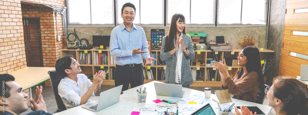 Millennial boss team leader introducing New asian woman employee to ...