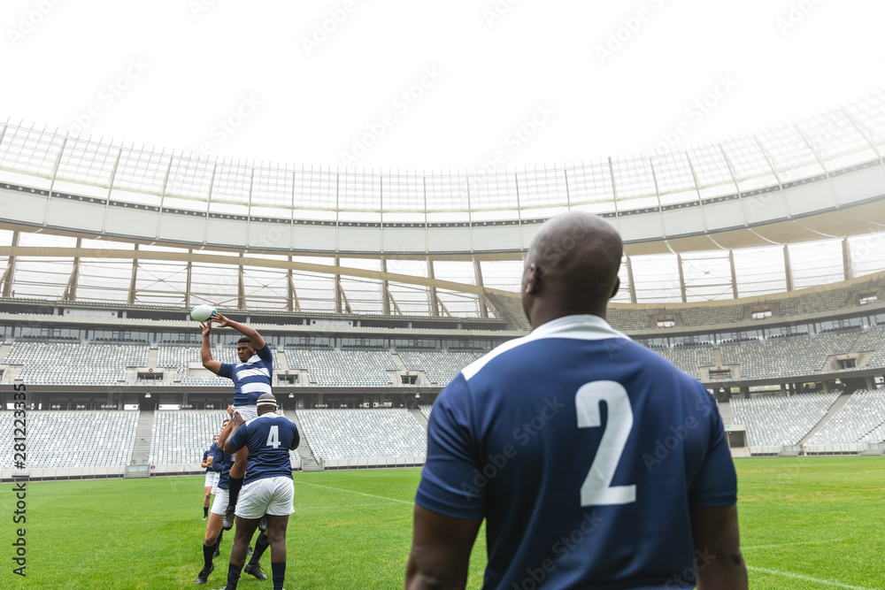 Group of diverse male rugby player playing rugby match in stadium Stock ...