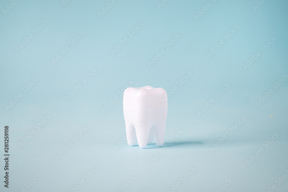 Dental care concept, Healthy tooth model on blue background with copy ...